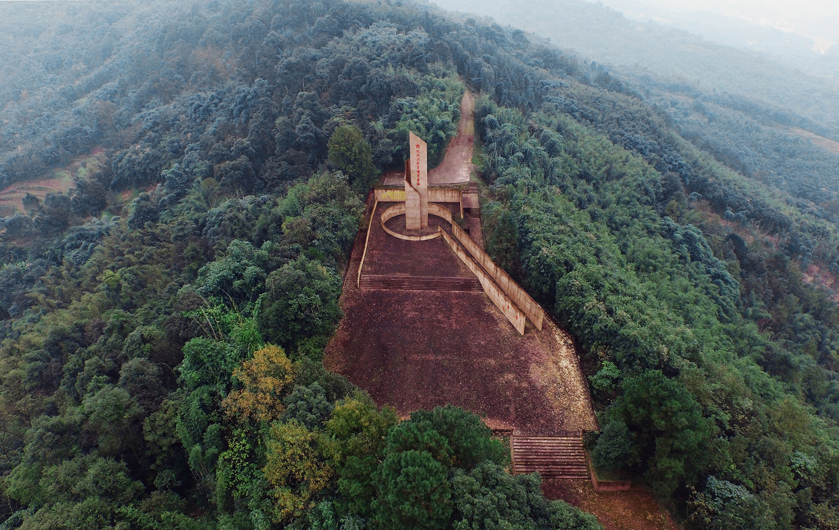A solitary rough concrete monument rises from destruction, China by ...