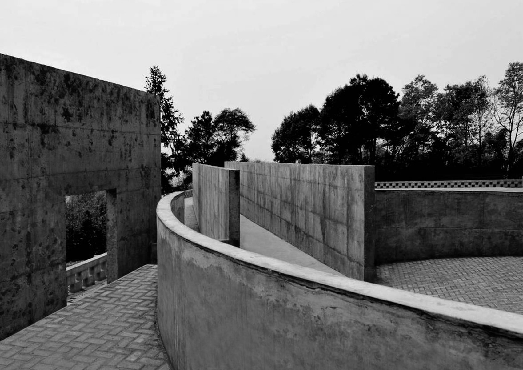 A solitary rough concrete monument rises from destruction, China by ...