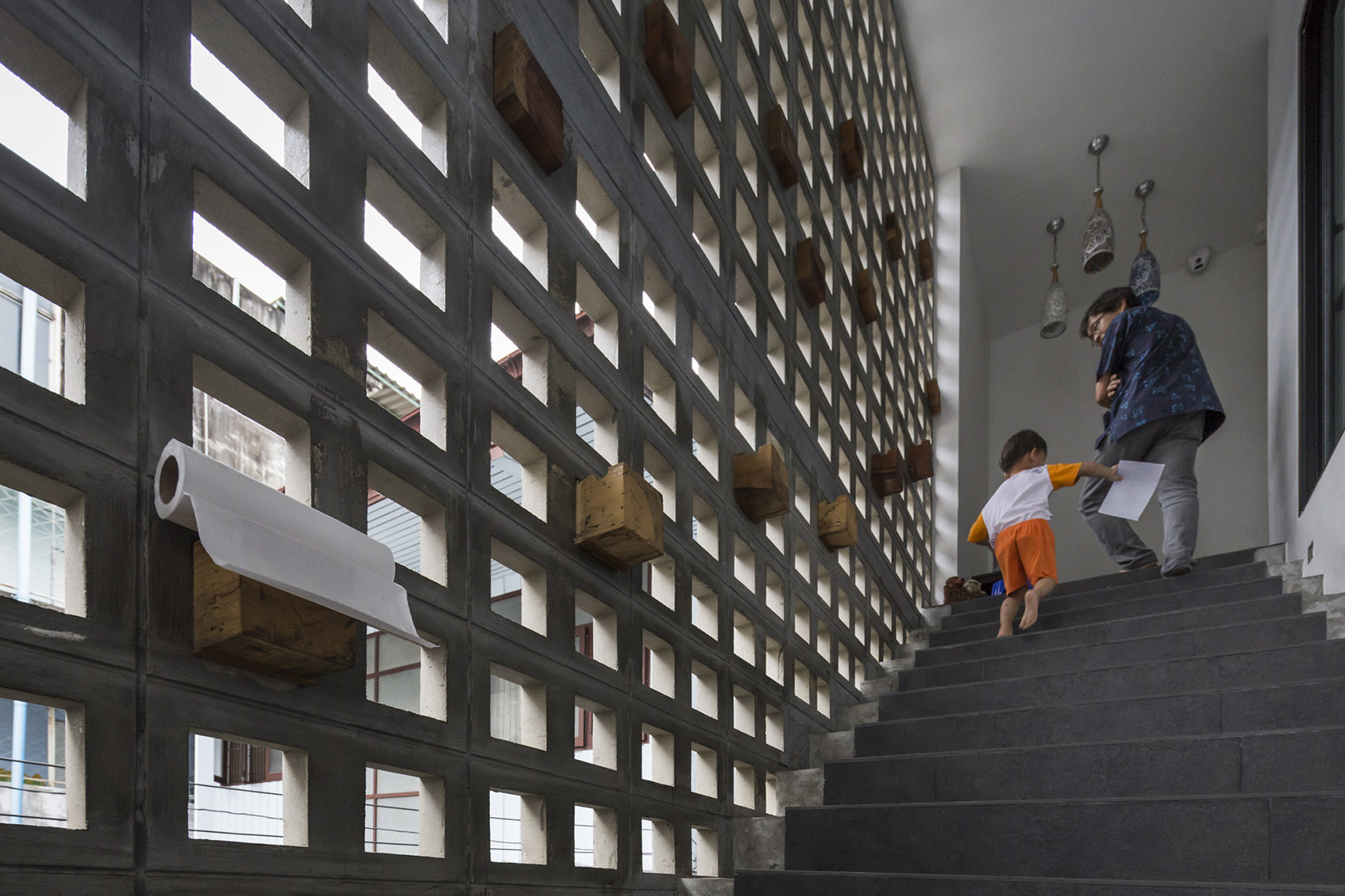 Multi-Place:Residential and Commercial space for two families by EKAR ...