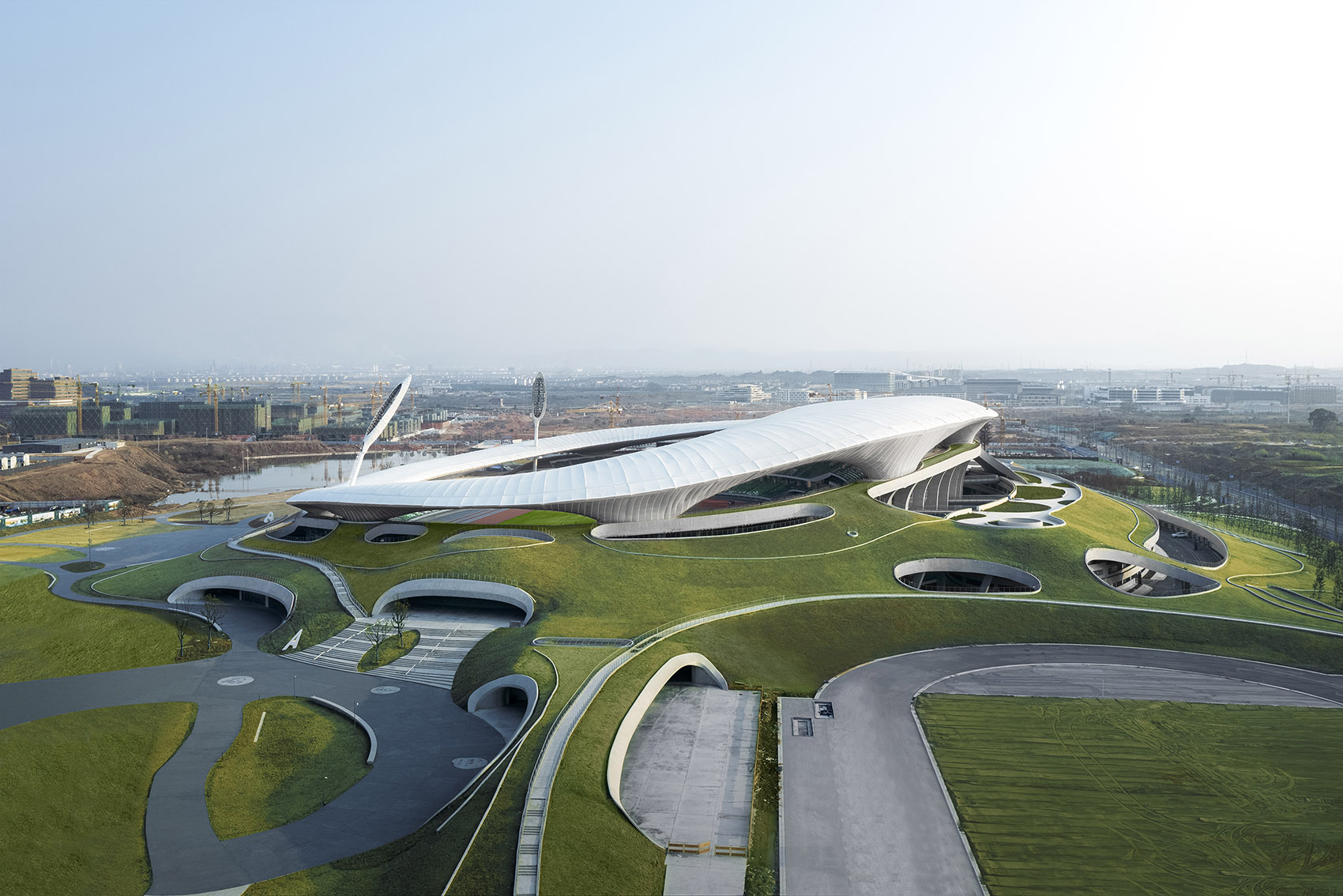 MAD Architects Completes the World’s Largest Earth-sheltered Stadium ...