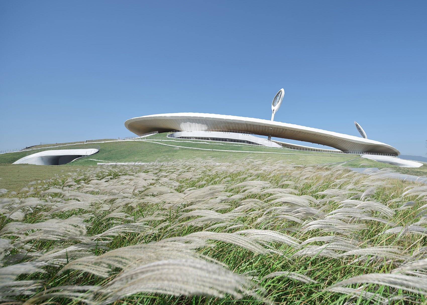 MAD Architects Completes the World’s Largest Earth-sheltered Stadium ...