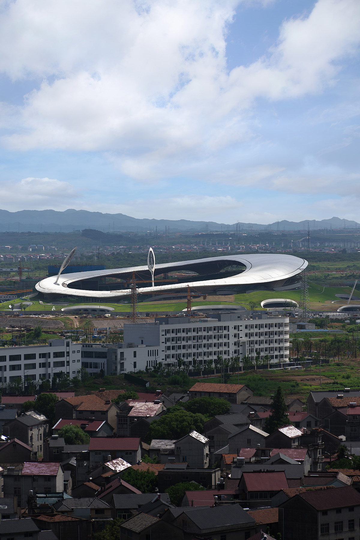 MAD Architects Completes the World’s Largest Earth-sheltered Stadium ...