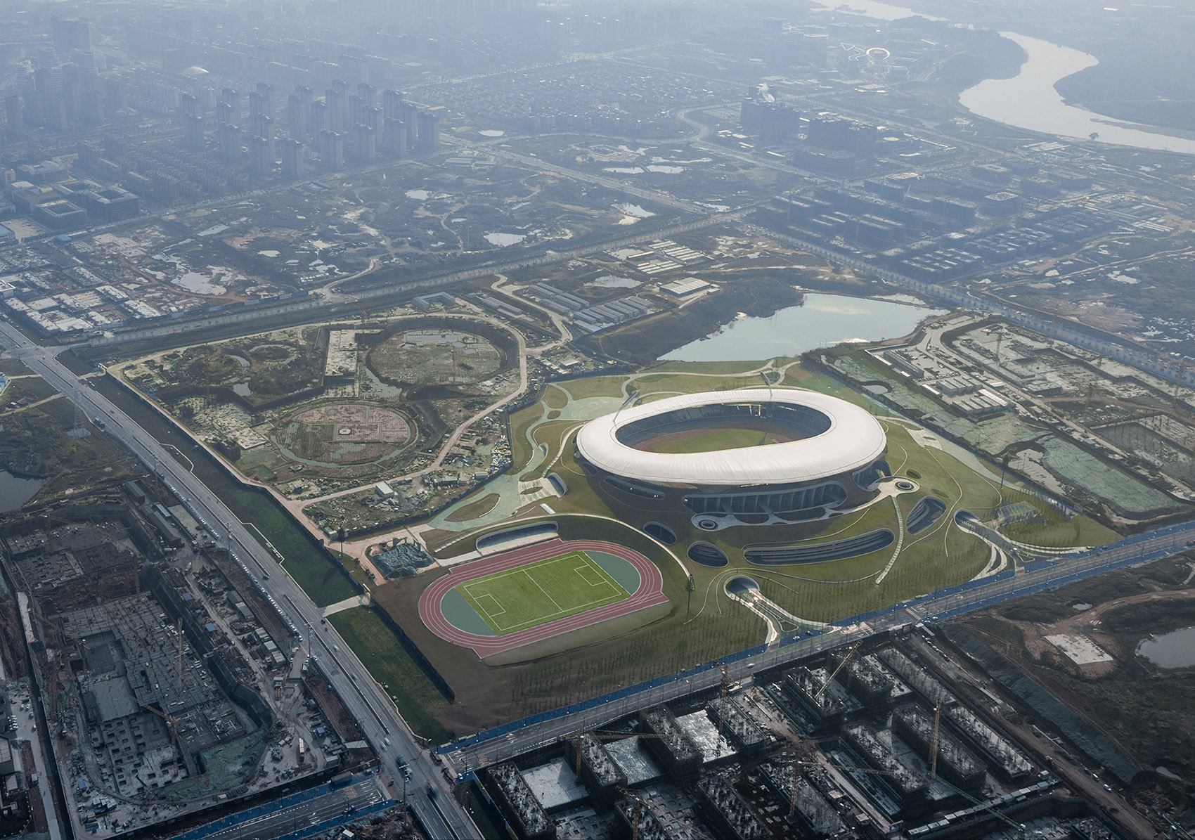 MAD Architects Completes the World’s Largest Earth-sheltered Stadium ...