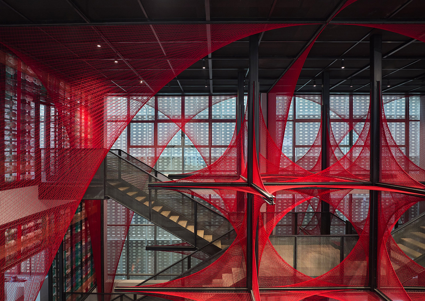 The Flower of Tujia at the China Tujia Brocade Art Museum by YI+MU Design Office - 谷德设计网