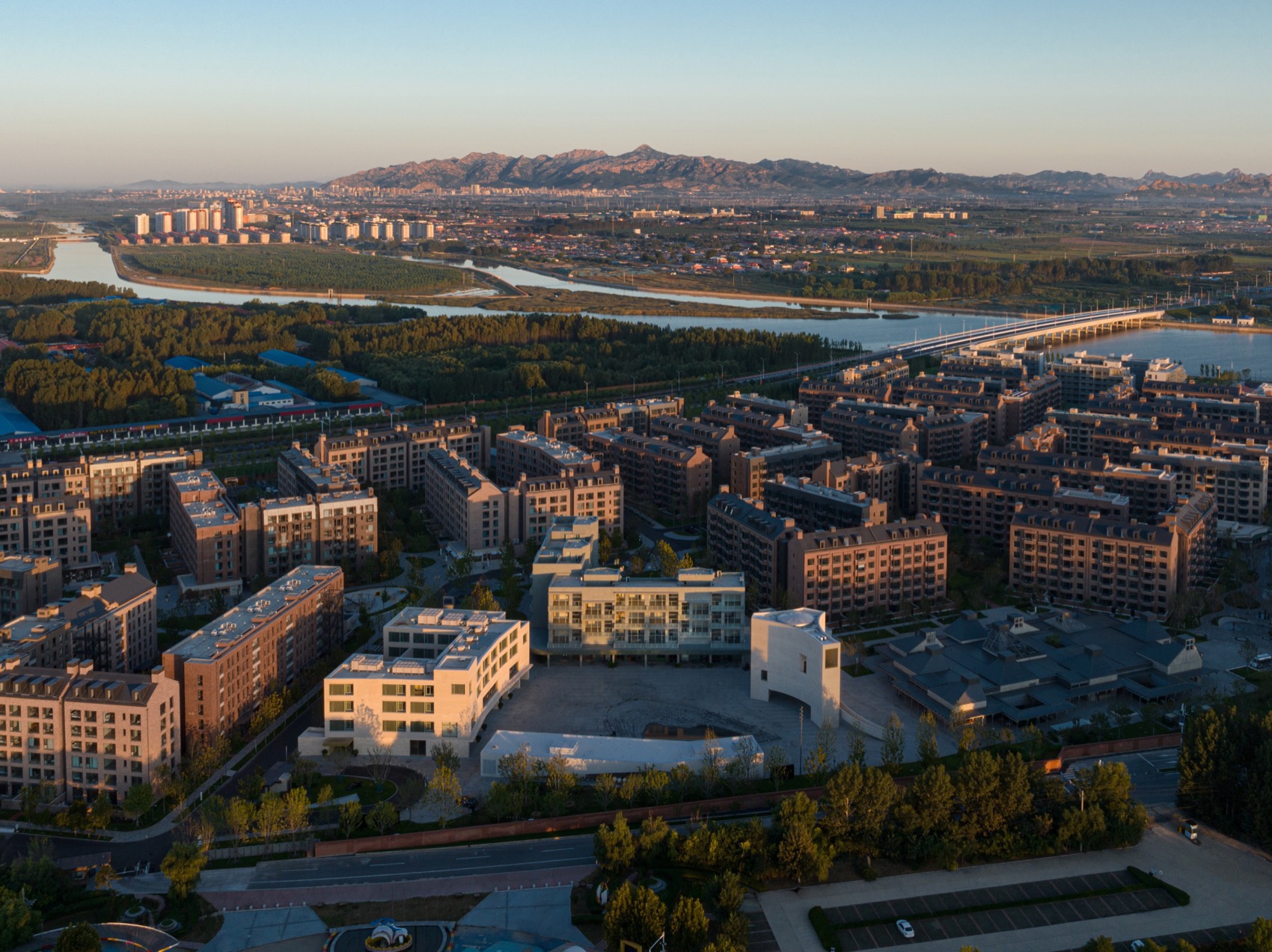 Aranya Youyi Bay Community, Mi Casa Su Casa Club Hotel, and Juanzong Apartment by genarchitects ...