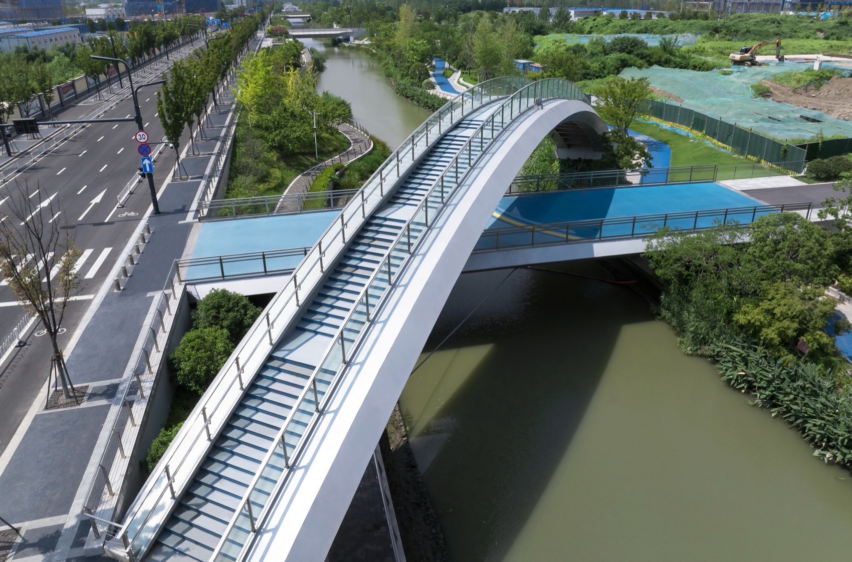 Pedestrian and vehicular bridges for Nanjing’s Nanbu New Town by NAN ...