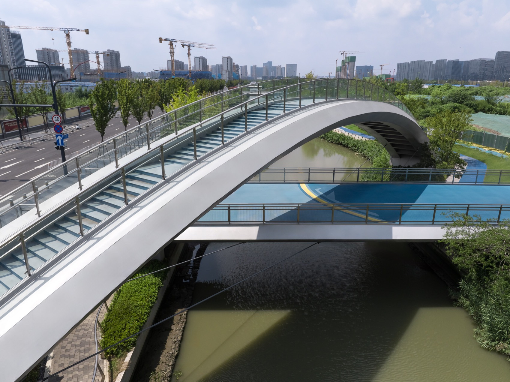 Pedestrian and vehicular bridges for Nanjing’s Nanbu New Town by NAN ...
